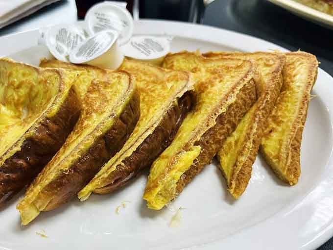 French toast done right: golden, buttery, and completely unapologetic about making you need a nap later.