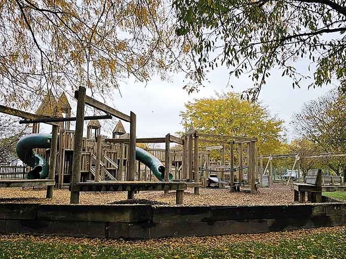 Autumn leaves frame playground equipment that's seen countless kids discover gravity the fun way over the years.