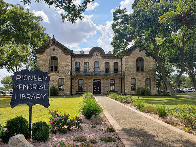 This limestone library building radiates old-world elegance, proving pioneers valued books as much as they valued land.