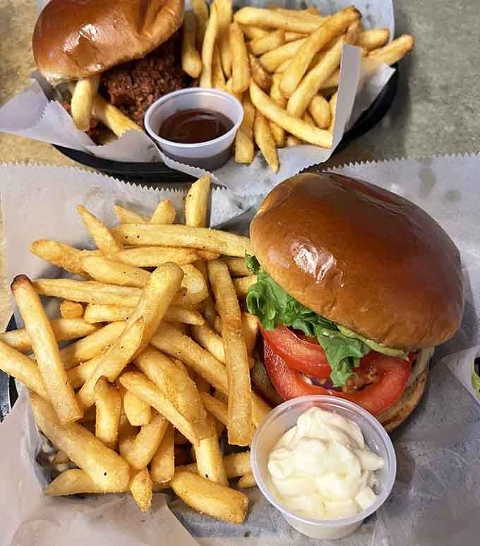 Classic burgers done right, with fries piled high and that golden-brown perfection that makes your mouth water instantly.