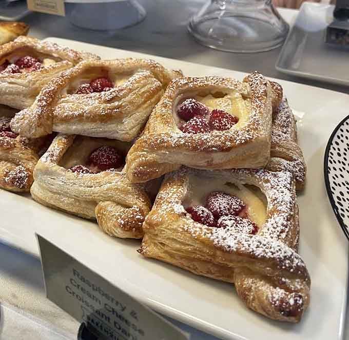 Those raspberry-filled danishes with their delicate powdered sugar dusting are basically pastry poetry you can actually eat.