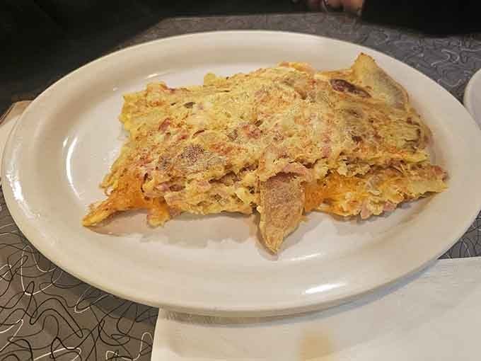 Turkey club stacked so high it requires architectural planning and possibly a building permit to consume.