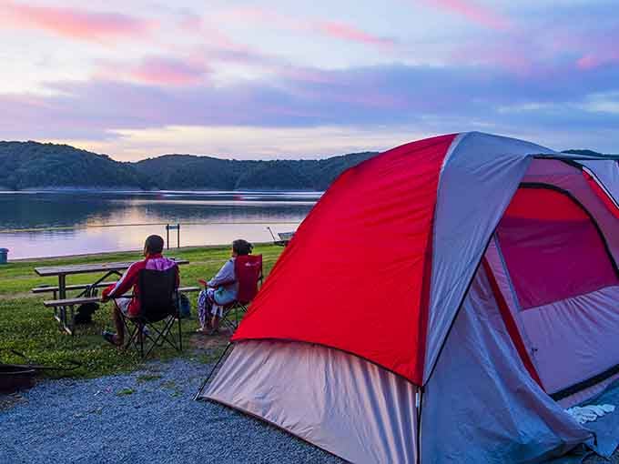 That lakeside camping setup with the sunset view is basically nature's version of premium cable, but infinitely better.