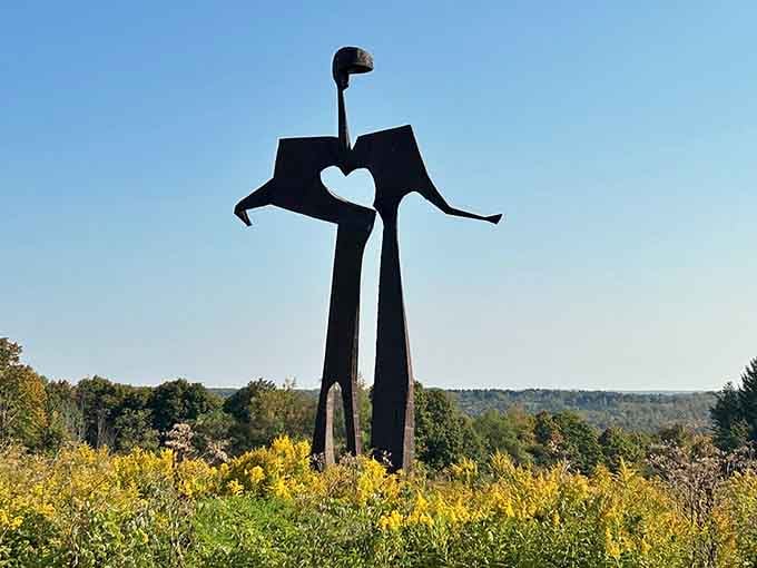 Flat Man defies gravity and logic, featuring a heart-shaped cutout that's become everyone's favorite photo opportunity backdrop.