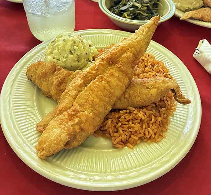 Fried fish so perfectly crispy it could audition for a cooking show, served with red rice that's a Gullah staple worth celebrating.