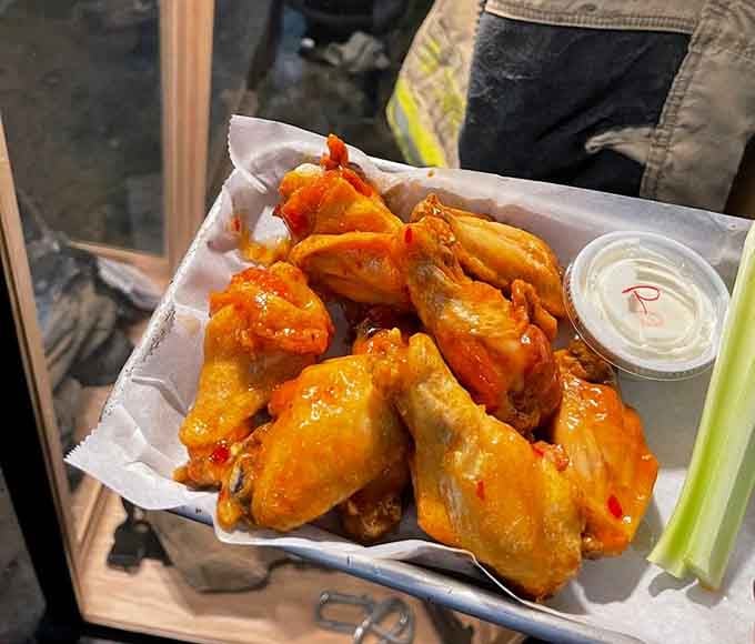 Sweet Thai wings glisten like they've been kissed by culinary angels, delivering heat and sweet in perfect harmony.