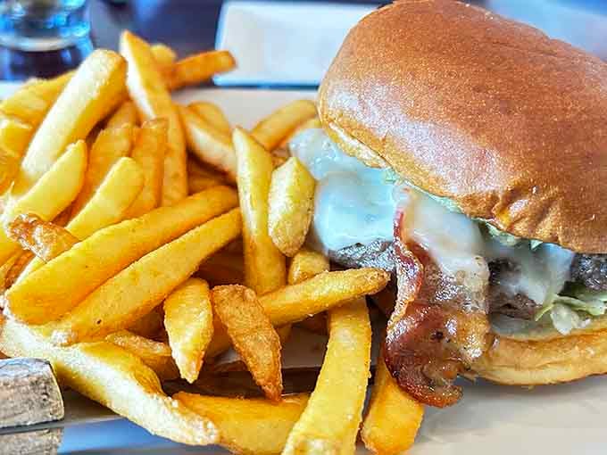 A burger oozing with melted cheese and a mountain of golden fries is pure comfort on a plate.