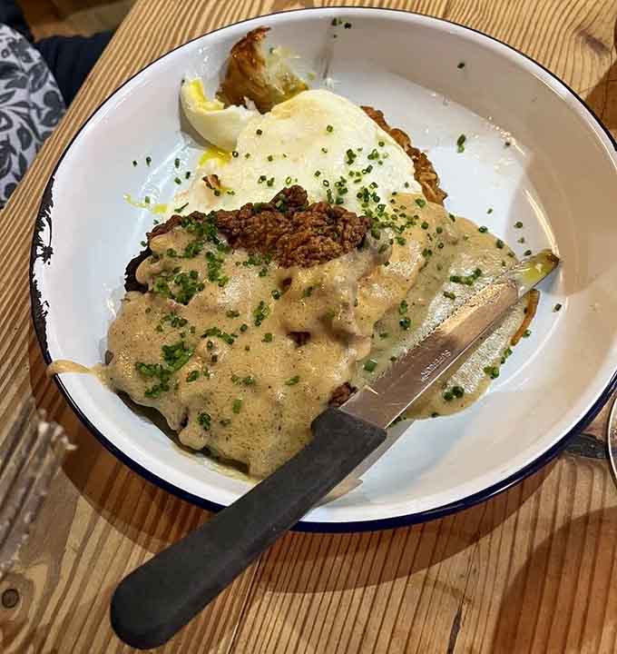 Country fried steak smothered in gravy proves that sometimes the best things in life require extra napkins and zero shame.