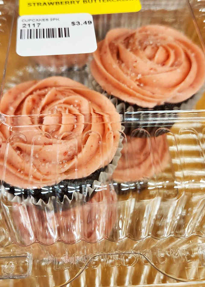 Strawberry buttercream cupcakes with rosette frosting so perfect, you'll feel guilty destroying such edible art. You'll get over it.
