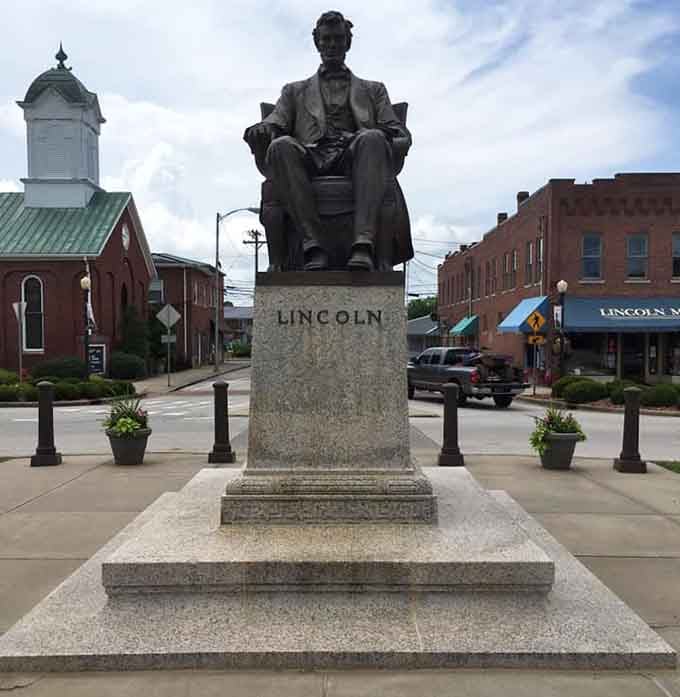 Lincoln sits in bronze contemplation, watching over the town that shaped the man who'd shape a nation.