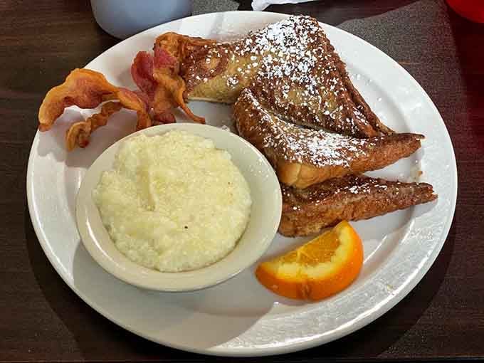 French toast dusted with powdered sugar and crispy bacon: breakfast's power couple reunited at last.