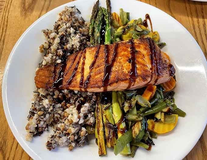 Grilled salmon with asparagus and wild rice proves this place takes dinner as seriously as breakfast.