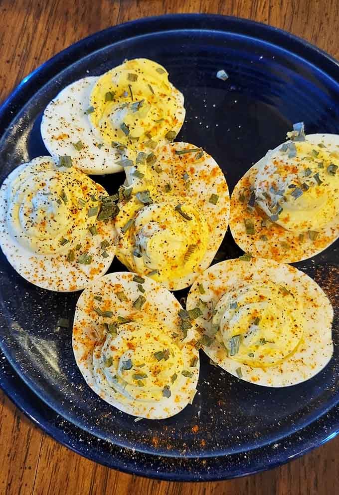 Deviled eggs arranged like edible art, proving that simple classics never go out of style when done right.