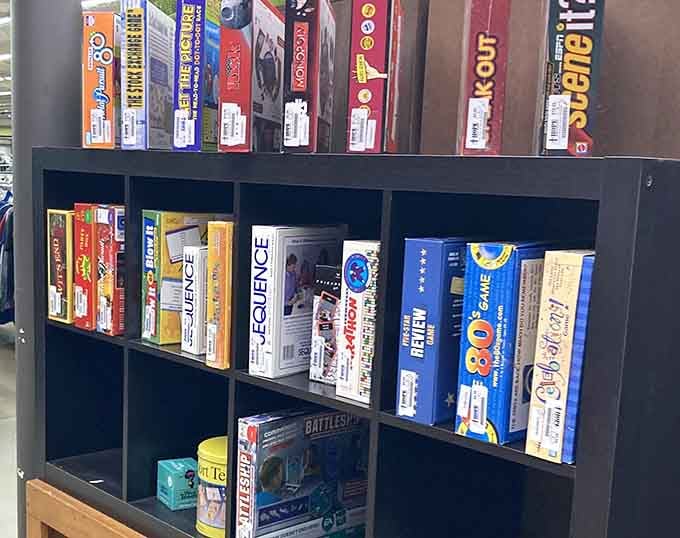 Board games and puzzles waiting patiently for their next family game night to bring joy once again.
