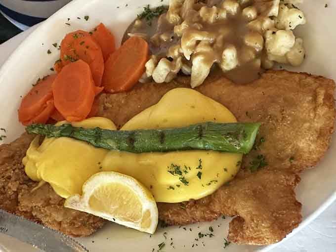 Oscar schnitzel arrives like it's auditioning for a cooking show, golden and gorgeous with all the right accompaniments in tow.