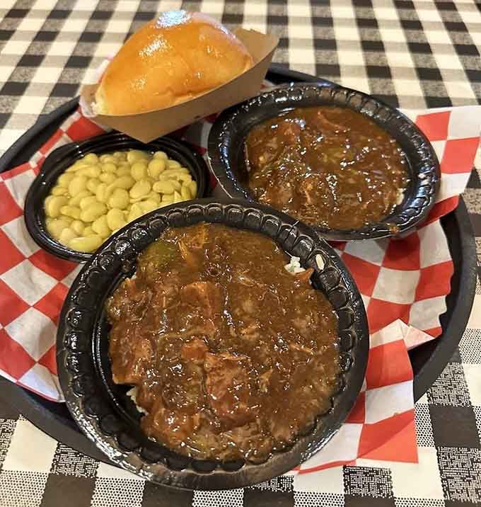 Beef tips swimming in rich gravy alongside mac and cheese—this is what happiness looks like on a plate.