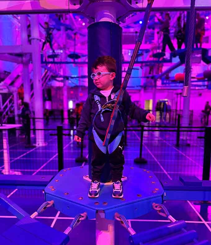 This young adventurer is living proof that being harnessed to a safety system makes you approximately 47% braver than usual.