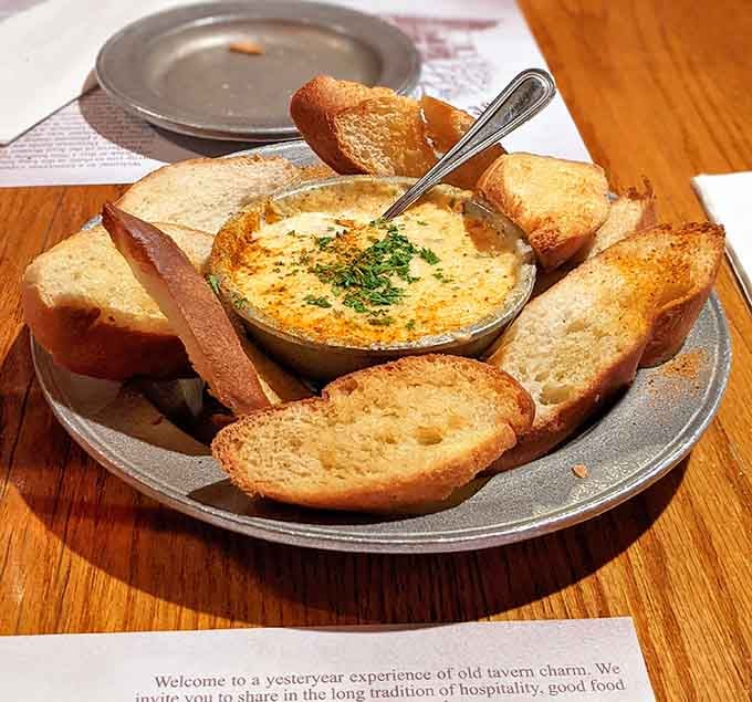 Creamy shrimp and crab dip with toasted bread, the kind of appetizer that makes you reconsider ordering an entree.
