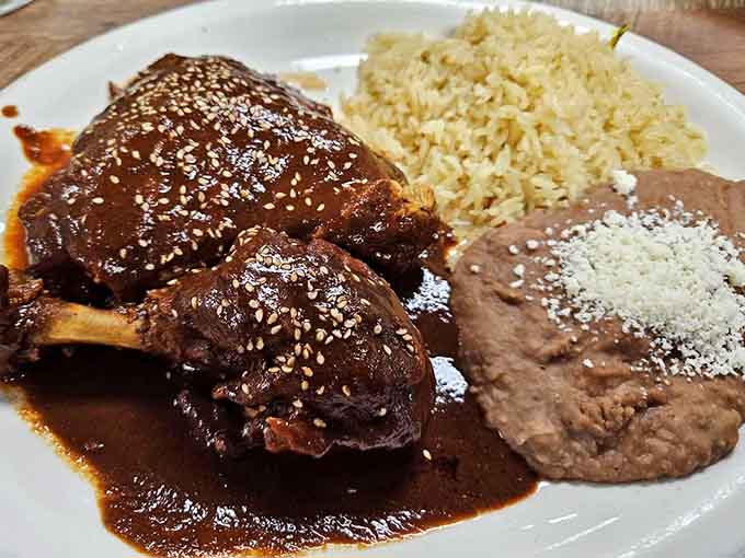 Mole poblano draped over tender meat with rice and beans is comfort food that required serious culinary skill.