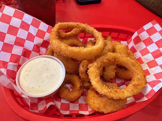 Perfectly breaded onion rings that prove circles are the superior geometric shape, at least when they're fried.
