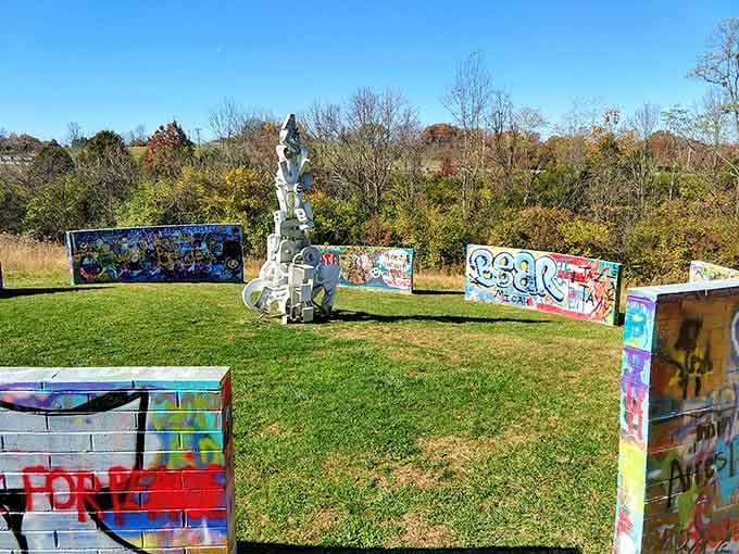 Colorful graffiti panels and a white guitar sculpture create an unexpected outdoor gallery that rocks the countryside.