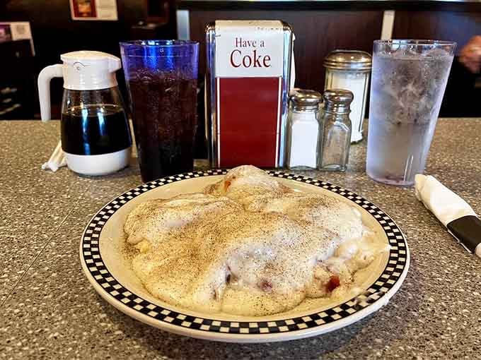 Kathy&rsquo;s Restaurant piles biscuits and gravy high, creamy, peppery comfort beside coffee, promising a satisfying Virginia morning.