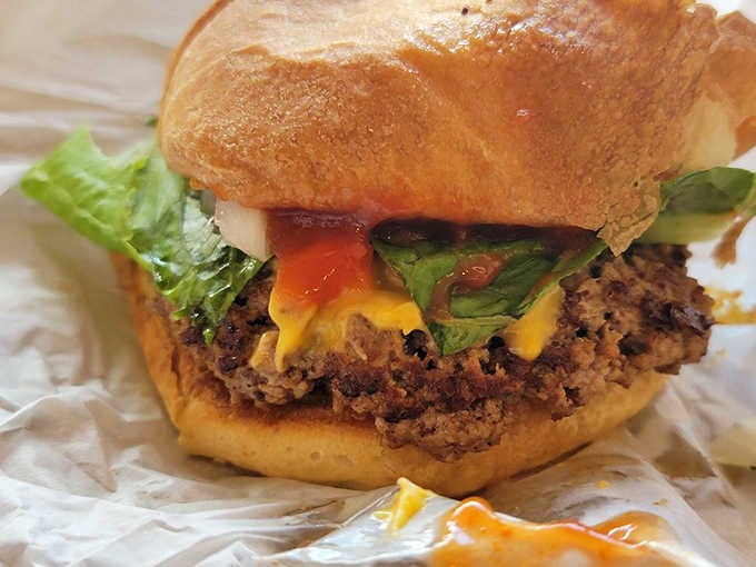 When melted cheese cascades over perfectly grilled beef like a delicious avalanche, you know you've found something special worth celebrating.