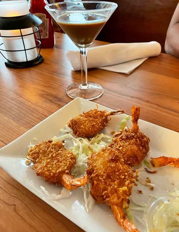 Coconut shrimp that looks this good deserves its own Instagram account, crispy, sweet, and paired with a perfectly mixed cocktail for good measure.