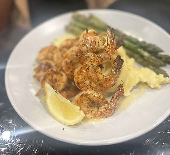 Perfectly seasoned shrimp alongside asparagus and mashed potatoes create a plate that's both elegant and utterly satisfying to devour.