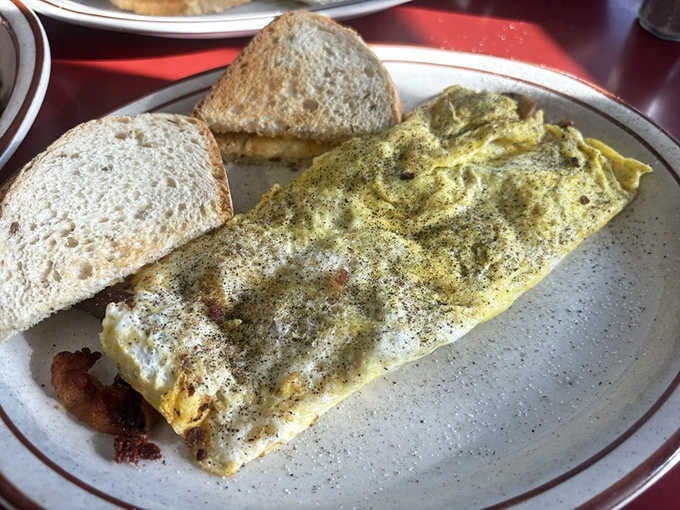 A perfectly folded omelet that proves simple techniques and quality ingredients beat fancy every single time.
