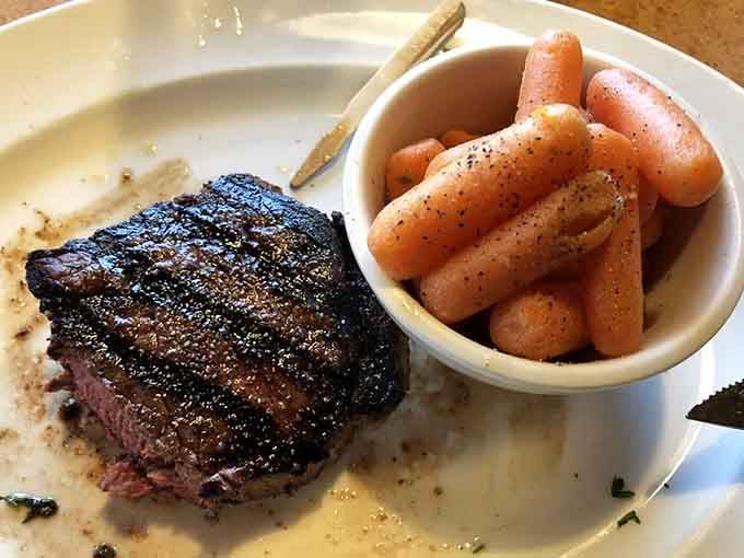 Charred sirloin with glazed carrots proves sometimes the classics need no improvement, just proper execution.
