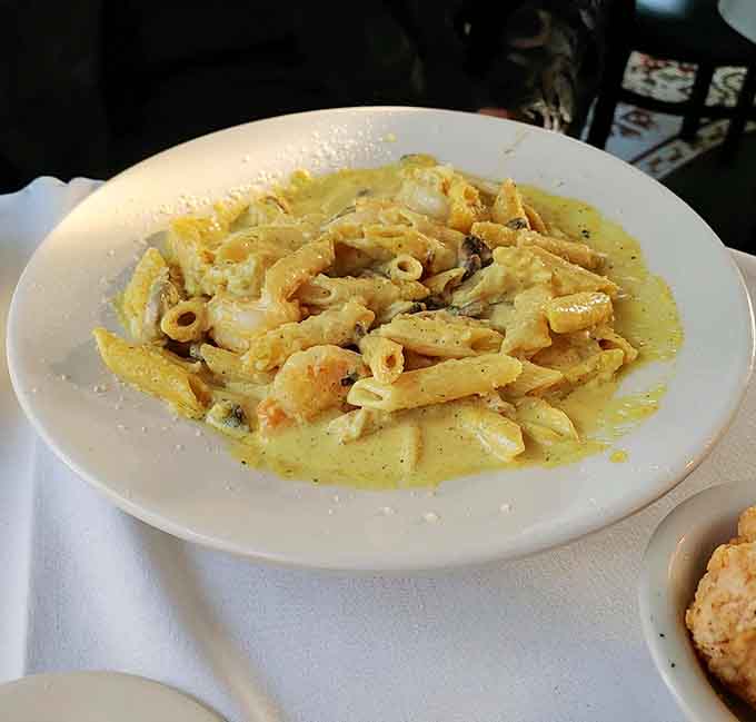 Penne Con Fungi swimming in curry cream sauce, because Italian food gets interesting when Missouri gets involved.