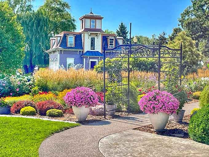 Vibrant gardens frame a Victorian home that looks like it stepped out of a storybook, minus the talking animals.