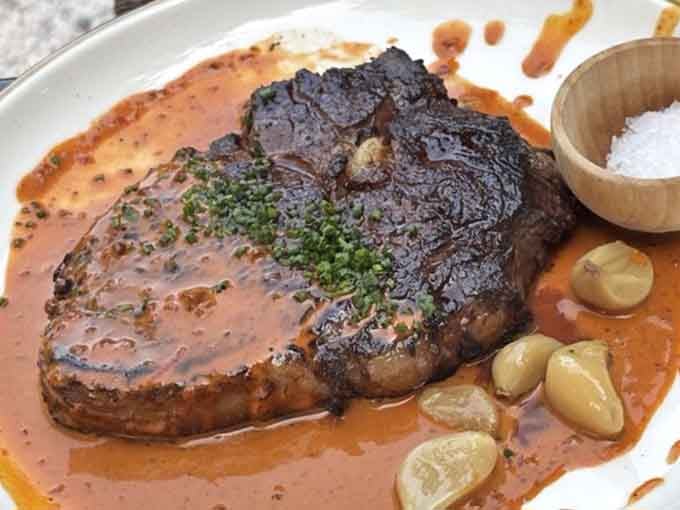 That ribeye didn't just kiss the fire; it had a full conversation, resulting in a beautifully charred masterpiece worth savoring.