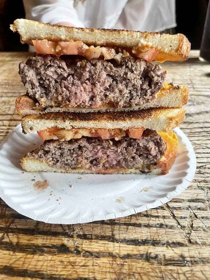 Two burgers stacked high prove that sometimes the best things in life come in multiples under ten bucks.