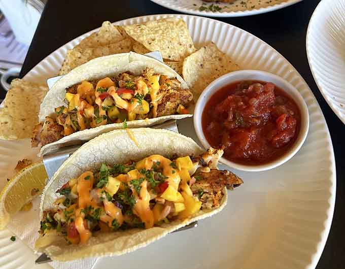 Colorful tacos bursting with seasoned protein and fresh toppings, proving handheld food can be downright elegant.