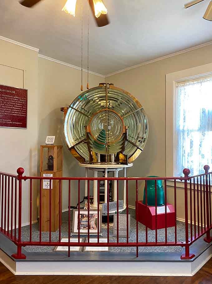 The original Fresnel lens sparkles like a giant jewel, still magnificent after guiding countless ships through dark waters.