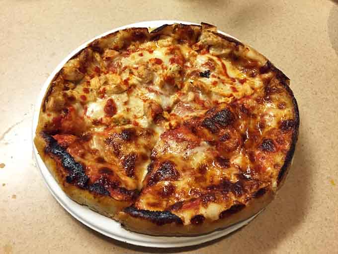 Look at that thick, golden crust holding all that cheese&mdash;this is what deep-dish dreams are made of.