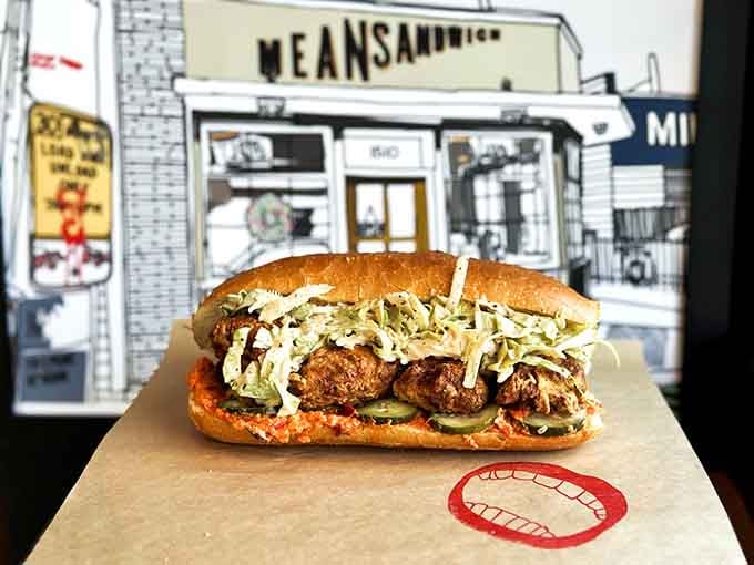 That fried chicken po'boy sits there looking innocent until you realize it's about to challenge your jaw's maximum capacity.