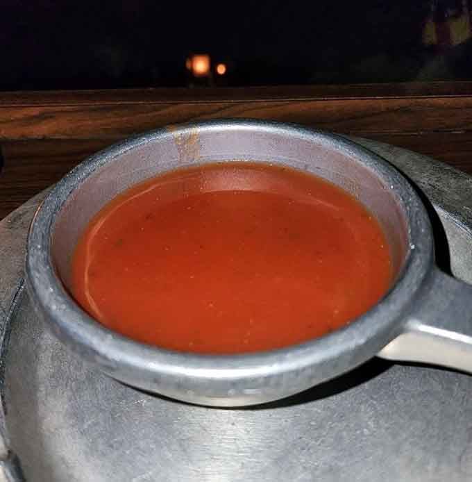 Tomato bisque served in a proper bowl, drink it down like royalty before the tournament action begins.