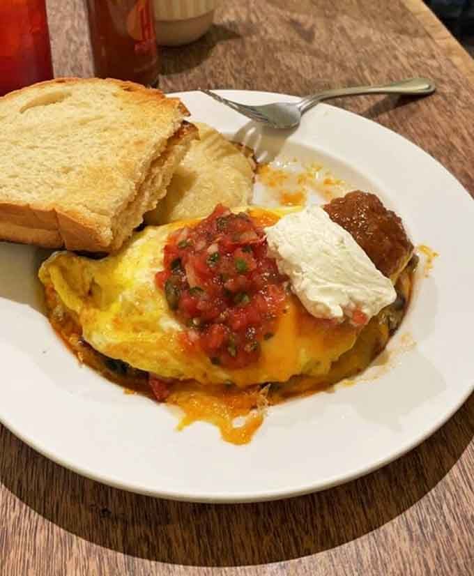 This omelette arrives like a fluffy cloud of happiness, ready to make your morning infinitely better than expected.