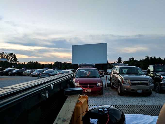 Rows of vehicles parked and ready, each one a private viewing box under the stars tonight.