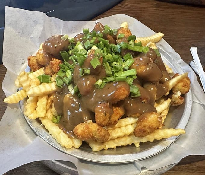 Crispy fries drowning in gravy and tater tots create the kind of indulgent comfort food dreams are made of.