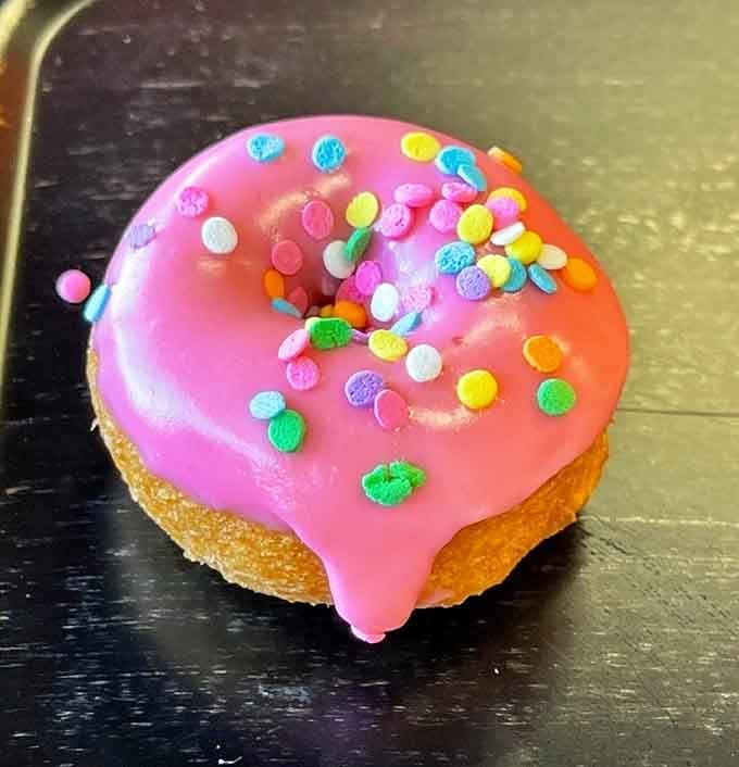 Pink frosting and rainbow sprinkles prove that sometimes the most joyful things are also the most delicious things.