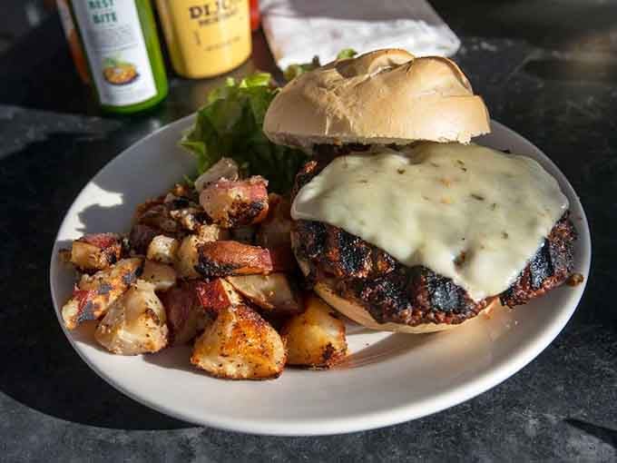 That melted cheese cascading over a perfectly cooked patty with crispy potatoes is what burger dreams are made of, friends.