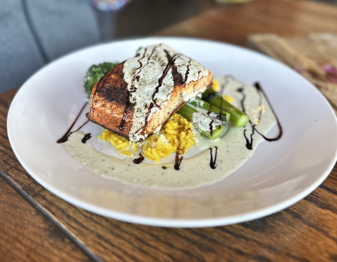 Salmon so perfectly cooked it could teach a masterclass, served with vegetables that actually look appetizing for once.