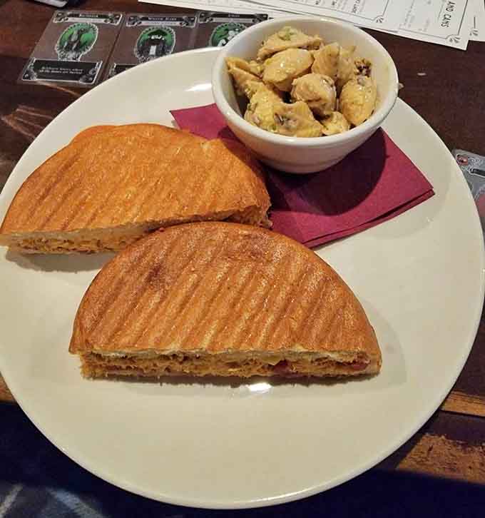 Two golden paninis paired with mac and cheese, because sometimes the best strategy is ordering the comfort food combo.