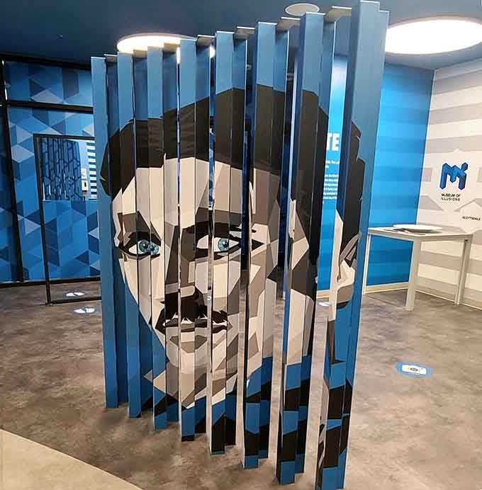 A face emerges from vertical slices like magic, reminding you that perspective changes absolutely everything you see.