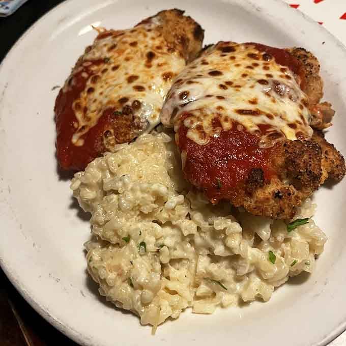 Chicken parm with mac and cheese proves that sometimes the best innovations are deliciously simple combinations.