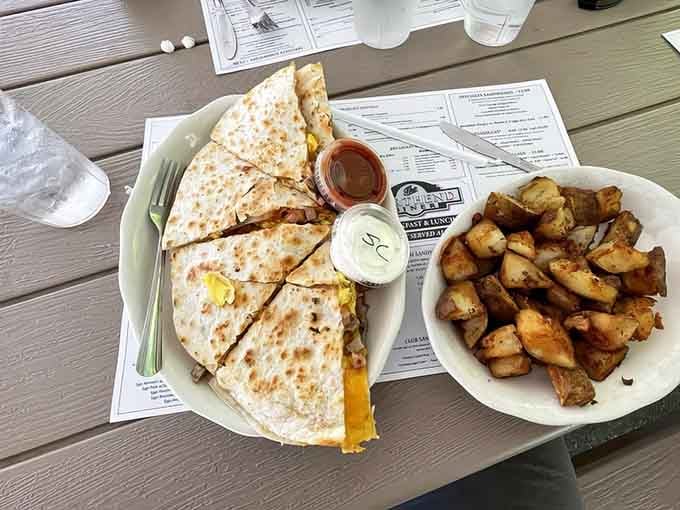This breakfast quesadilla arrives loaded and ready to fuel your entire day without requiring a second meal.
